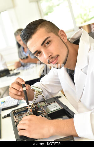student in technology fixing computer processing Stock Photo - Alamy