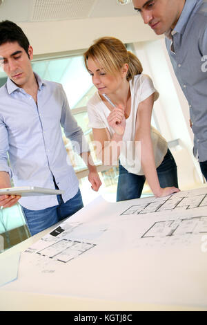 Business workgroup interacting in office Stock Photo - Alamy