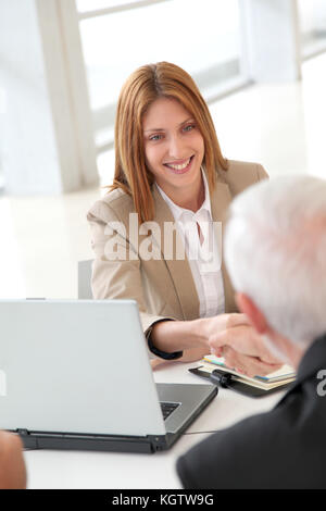 Contract conclusion. Business partners shaking hands in office Stock ...