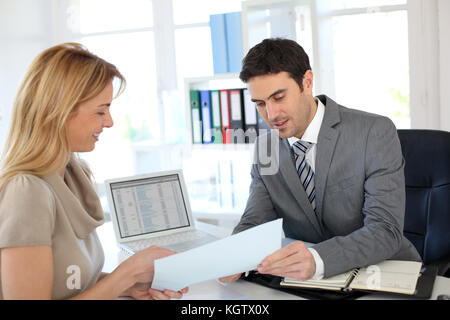 Woman meeting banker to set up her own business Stock Photo - Alamy