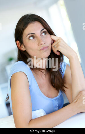 Closeup portrait beautiful unhappy doubtful angry grumpy young woman ...
