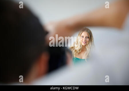 Back view of photographer photographing model Stock Photo - Alamy