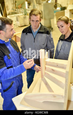 Group of students in woodwork training course Stock Photo - Alamy