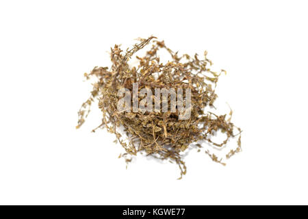 A pile of dried and fresh thyme Thymus vulgaris rests on a circular ...