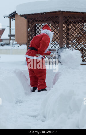 santa claus taking with shovel snow away to make the way free Stock ...