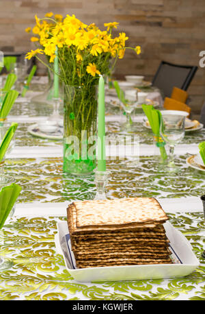 Modern Passover Seder table with green and gold decorations in Tel Aviv ...
