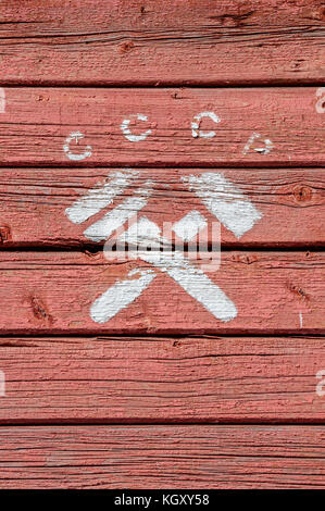 Letters CCCP (russian abbr. for USSR) and a crossed hammer and monkey ...