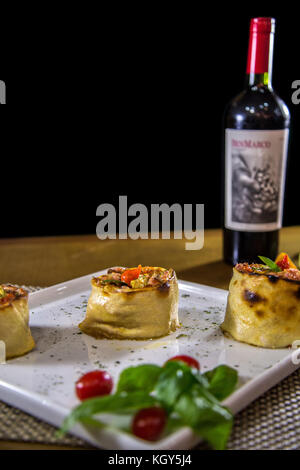 tasty rondelli pasta and cannelloni in white sauce with parmesan cheese ...