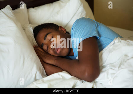 A teenage boy sleeping Stock Photo: 19372663 - Alamy