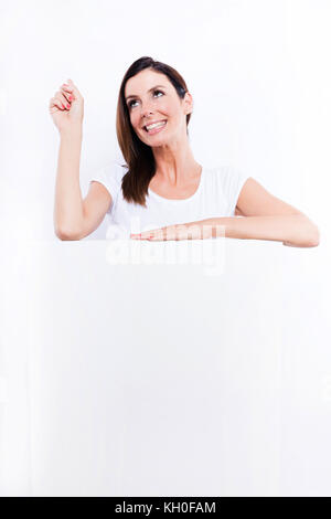Beautiful woman pointing to a blank sign Stock Photo - Alamy