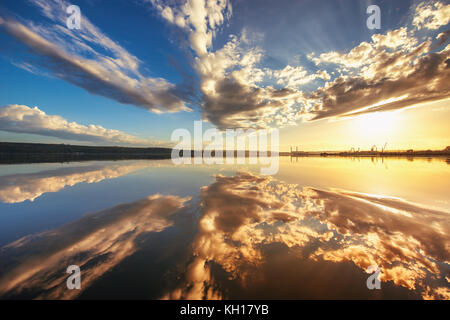 Beautiful shot of sunset over a lake Stock Photo - Alamy