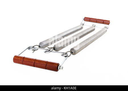 Traditional spring chest expanders against a white background Stock ...