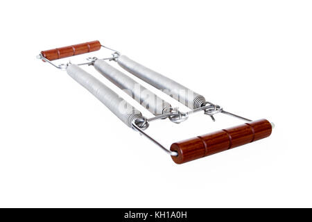 Traditional spring chest expanders against a white background Stock ...