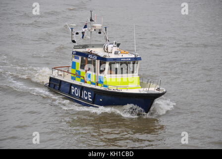 Thames River Police boat patrolling near to the City of London, UK ...
