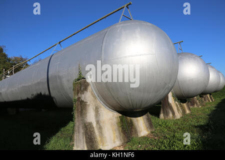 many huge tanks for the storage of methane gas in an industrial zone ...
