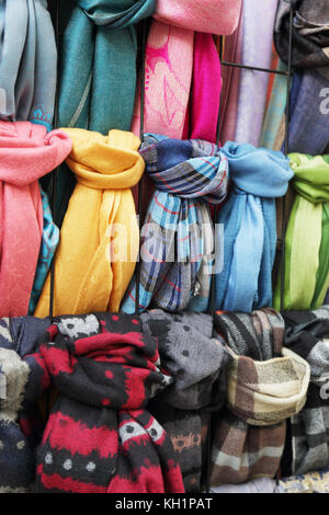 Different colored scarfs in the store Stock Photo - Alamy