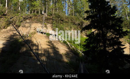 Logan Creek Suspension Bridge (in the shade) and the many ladders that ...