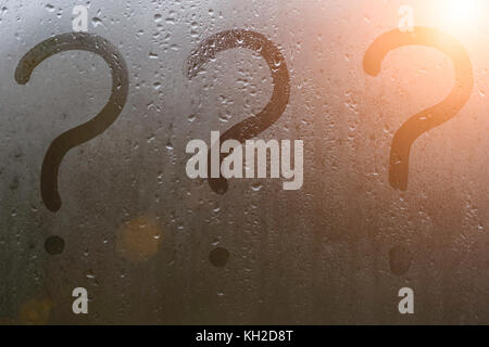 Question marks on the sweaty glass in the autumn Stock Photo - Alamy