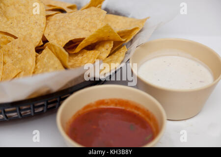 Tostada Chips and two kinds of dip Stock Photo - Alamy