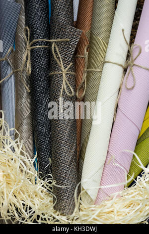 Rolls of wrapping paper binding with rope Stock Photo - Alamy