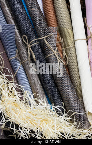 Rolls of wrapping paper binding with rope Stock Photo - Alamy