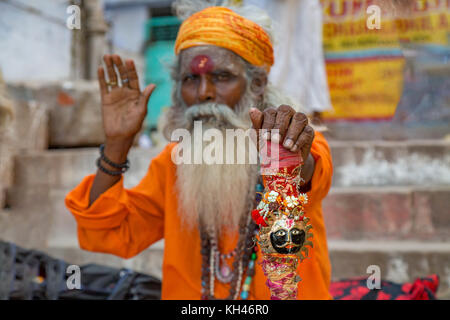 Portrait of a sadhu raising his hand as a blessing Stock Photo - Alamy