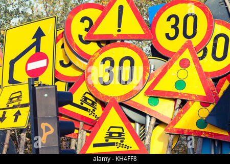 Many road signs stacked together waiting to be used again Stock Photo ...