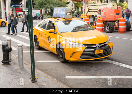 New York City: A Toyota yellow Medallion Taxi on Broadway in Hamilton ...