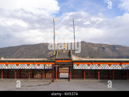 Prayer wheels alley in Rongwo monastery, Tongren County, Longwu, China ...