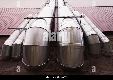 A burgundy building with trumpets against the sky Stock Photo - Alamy