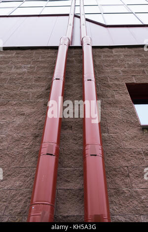 A burgundy building with trumpets against the sky Stock Photo - Alamy