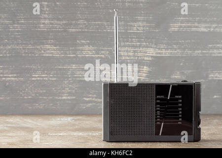 Old portable radio receiver device on wooden background Stock Photo - Alamy