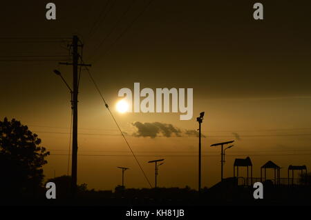 objects against rising sun Stock Photo - Alamy
