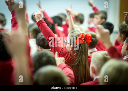Assembly in a girls' school in the East End of London, 1910 Stock Photo ...