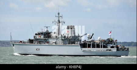 HMS Middleton (M34), a Hunt-class minehunter of the Royal Navy, passes ...