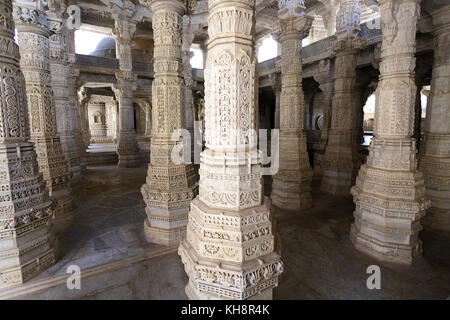 Stone carvings and marble pillars at The Ranakpur Jain Temple at Desuri ...