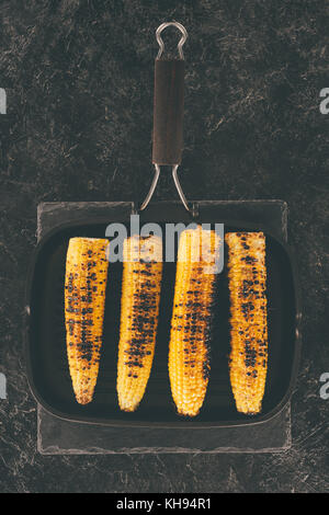 frying pan with grilled corncobs Stock Photo - Alamy