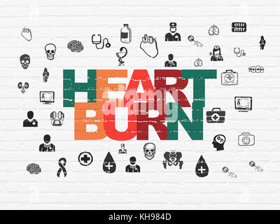 Health concept: Heartburn on wall background Stock Photo - Alamy