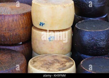 Whole cheese wheels on sale at the fresh food market Stock Photo - Alamy