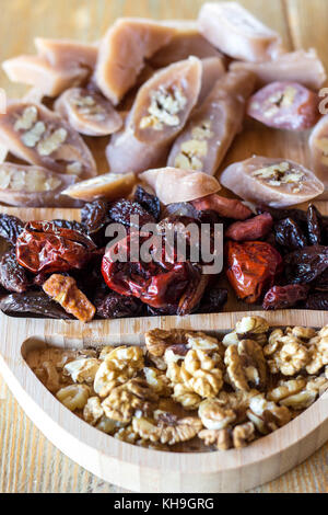 Traditional Georgian sweet Churchkhela with walnuts and pomegranate ...