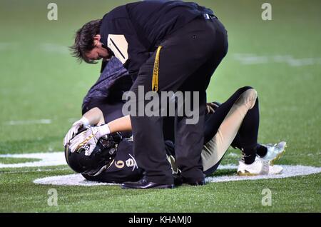 Injured high school football player is wheeled from the field by ...