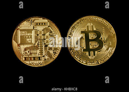 Golden Bitcoin front and backside on bright background Stock Photo - Alamy