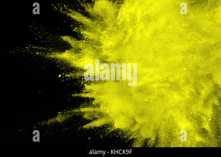 Green yellow dust particles explosion on black background. Powder dust ...