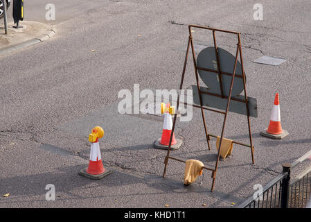 temporary road surface sign at roadworks installing new road surface ...