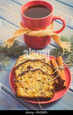 Christmas fruitcake and cup hot tea with lemon. Traditional European ...