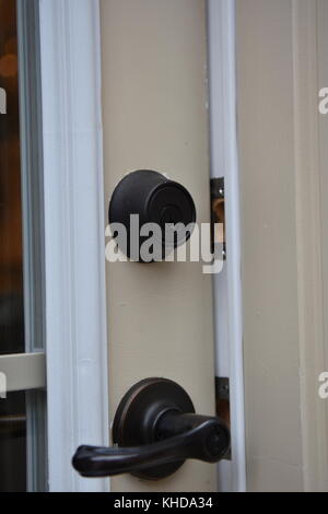 Door left unlocked and open Stock Photo - Alamy