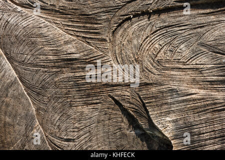 Close-up of grooves and saw marks on surface of pink painted wood plank ...