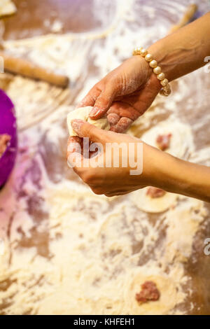 Preparing, cooking, making homemade dumplings with cabbage Stock Photo ...