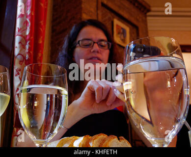 Woman use of cellphone in restaurant Stock Photo - Alamy