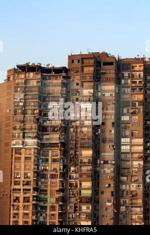 The Cairo, Egypt skyline with high rise buildings illuminated at dusk ...